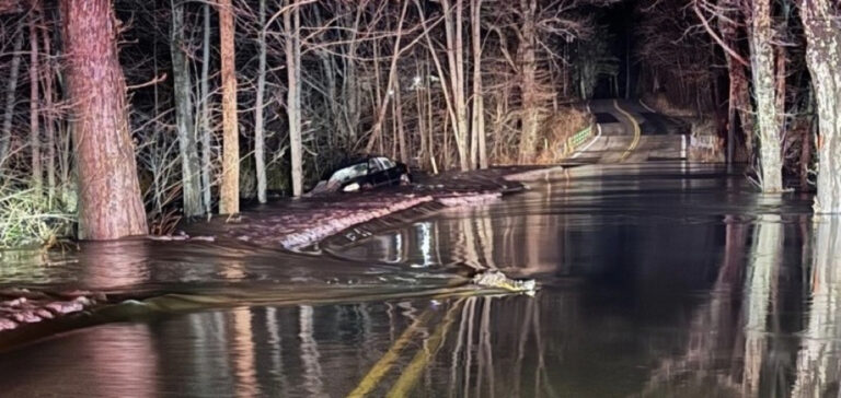 Emergency Services respond to Rochester Neck Road for flooding, sinking ...